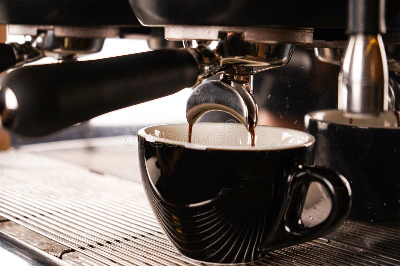 Pouring Coffee Stream from Professional Machine in Cup. Barista Man ...