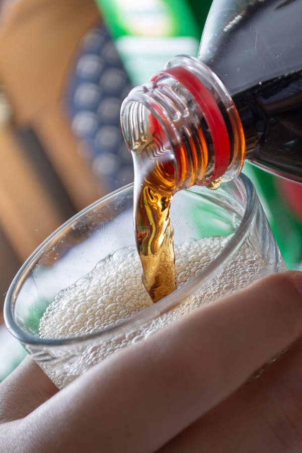 Pouring coke in the glass stock image. Image of pouring - 146790631