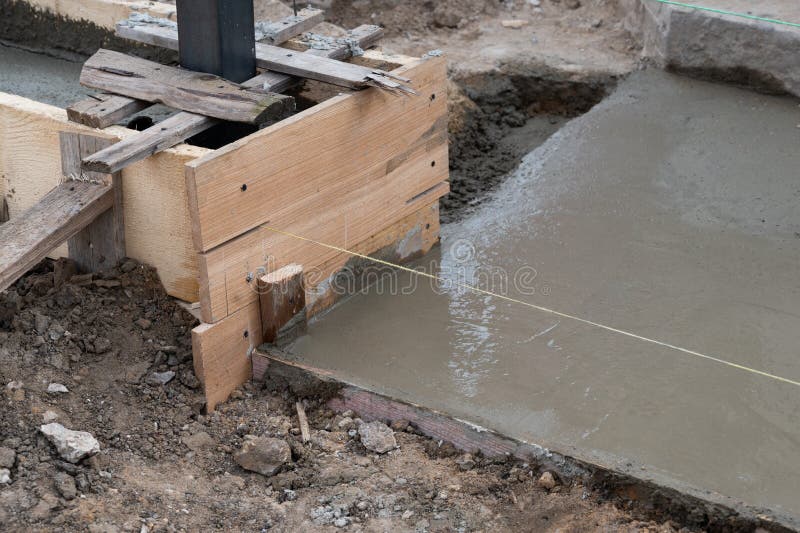 Pouring Concrete into Formwork for New Fence Stock Photo - Image of ...