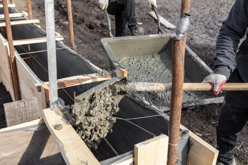 Pouring Concrete into the Foundation at a Construction Site Stock Photo ...