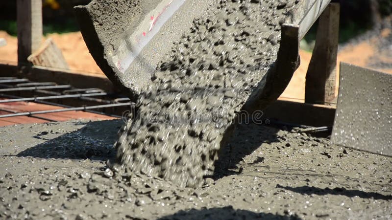 Pouring Concrete from a Truck Chute into an Excavation with Wooden ...