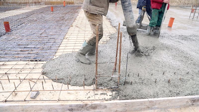 Workers at Construction Site Pour Cement into the Foundation from Cement Truck. Stock Footage ...