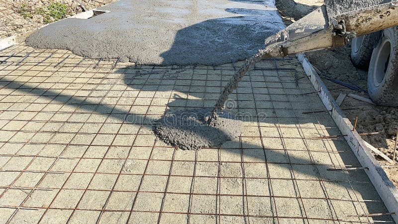 Pouring Concrete on Reinforced Concrete Roads Using a Ready-mix Cement ...