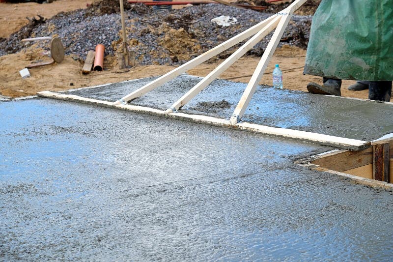Pouring concrete slab stock photo. Image of contractor - 92831790