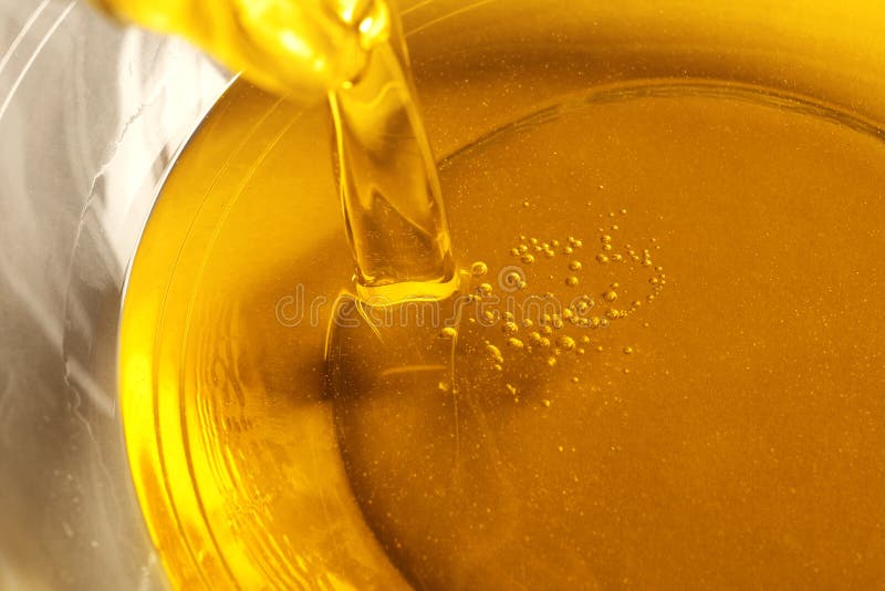 Pouring Cooking Oil into Bowl, Closeup View Stock Image - Image of ...