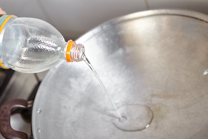 Pouring cooking oil stock image. Image of pouring, home - 51591761