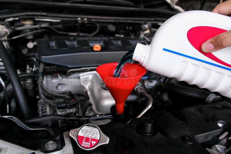 Pouring Coolant Fluid Using a Funnel into Car Radiator Stock Image ...