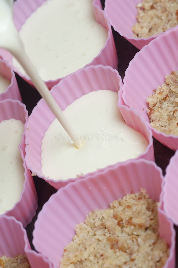 Pouring Creamy Filling into Cupcakes Stock Photo - Image of containers ...