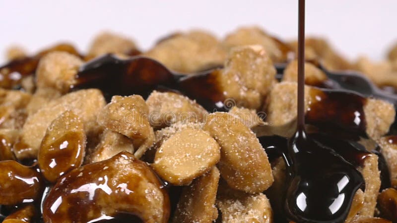 Pouring Delicious Chocolate Syrup Over Mixed Nuts Stock Footage - Video ...