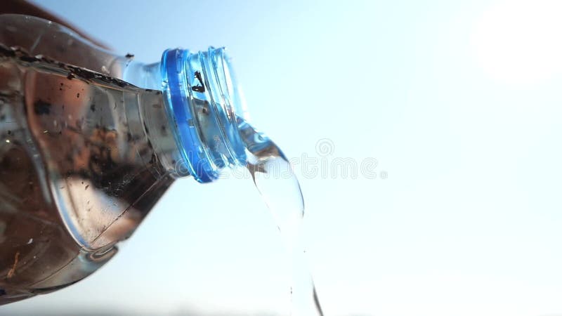 Pouring Dirty Water from a Plastic Bottle Stock Footage - Video of ...