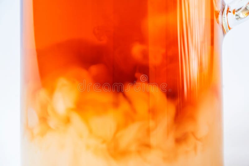 Pouring and Dissolwing Milk into Tea Jug Stock Photo - Image of ...