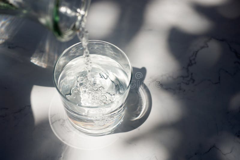 Pouring Drinking Water into a Clear Glass Stock Photo - Image of ...