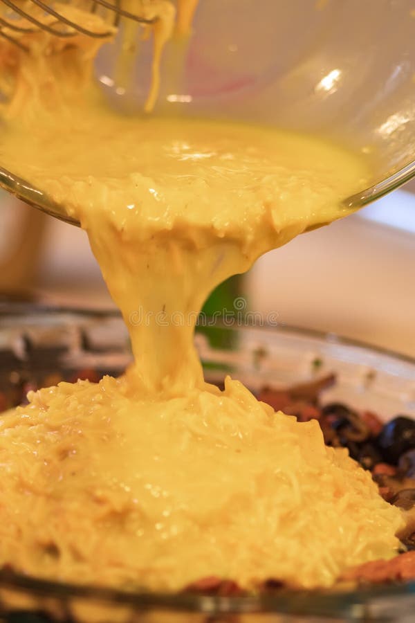 Pouring Egg and Cheese Mix stock photo. Image of delectable - 115752162