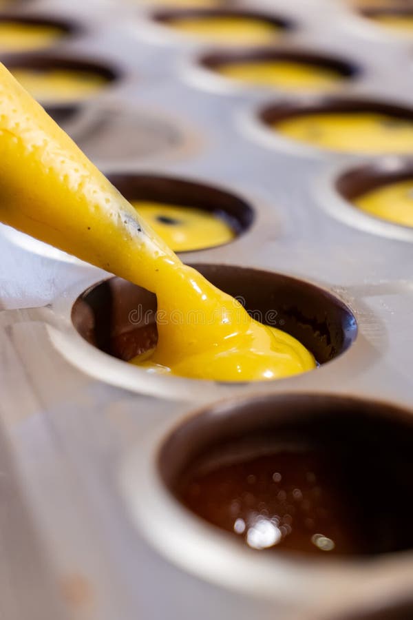 Pouring the Filling into Candies during the Manufacturing Process Stock ...
