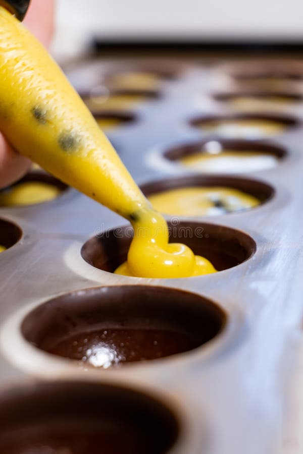 Pouring the Filling into Candies during the Manufacturing Process Stock ...