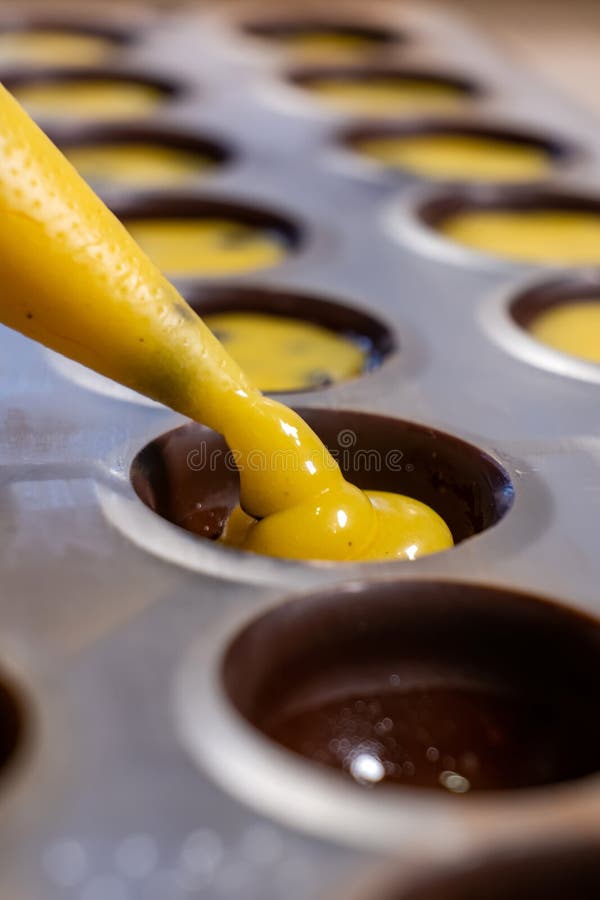 Pouring the Filling into Candies during the Manufacturing Process Stock ...