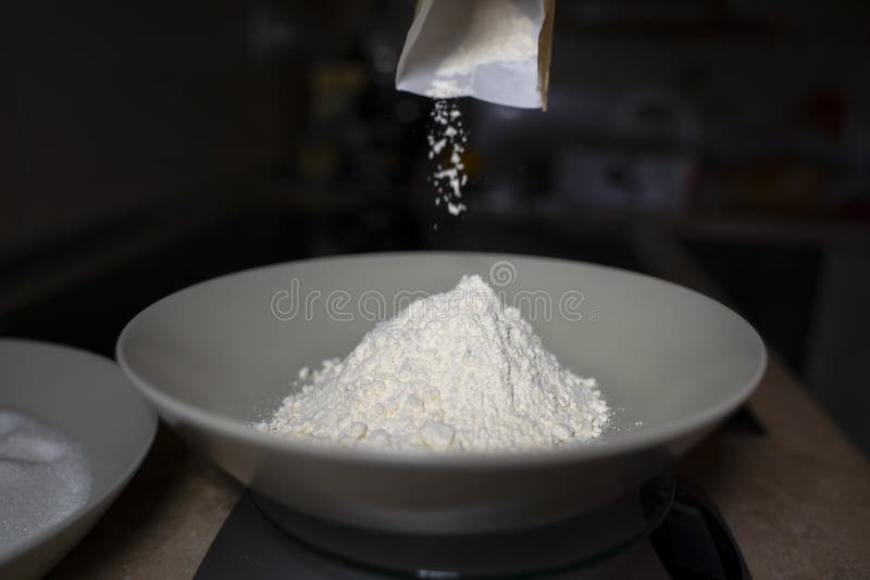 Pouring Flour into a Deep Plate. Low Light Stock Image - Image of ...