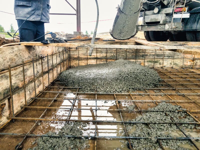 Pouring the Foundation with Concrete at the Construction Site ...