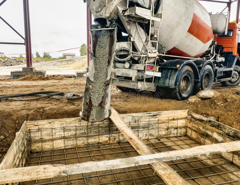 Pouring the Foundation with Concrete at the Construction Site. Monolithic Reinforced Concrete ...