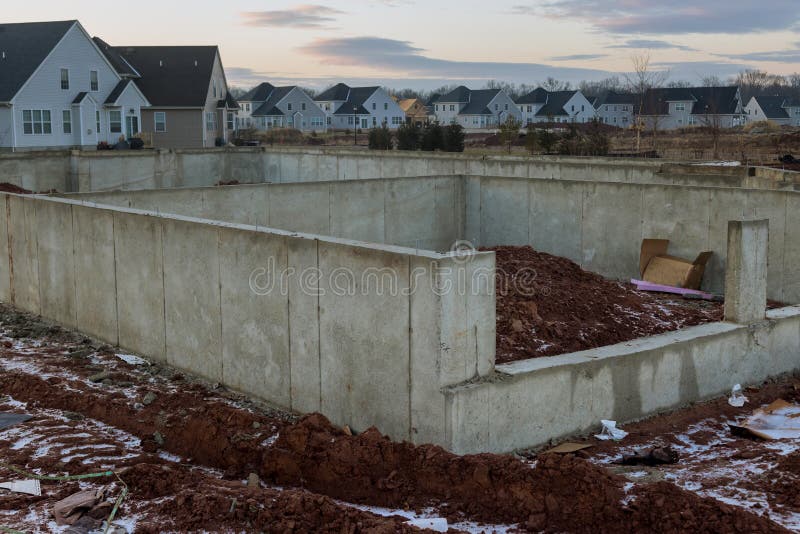 Pouring the Foundation for a New Building with Suburbs Stock Photo ...