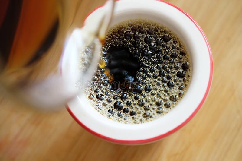 Pouring Freshly Brewed Black Pour Over Filter Coffee into Cup Close-up ...