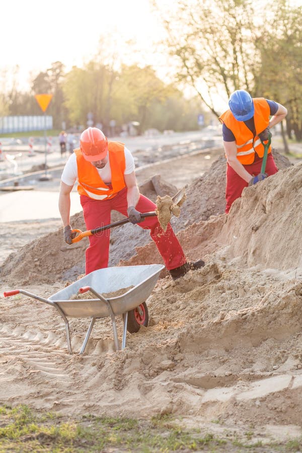 Pouring heavy sand stock photo. Image of sand, hardhat - 54648202