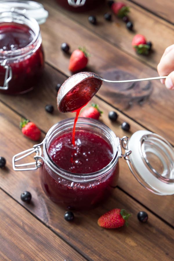 Pouring Homemade Berry Jam into a Jar Stock Photo - Image of closeup ...