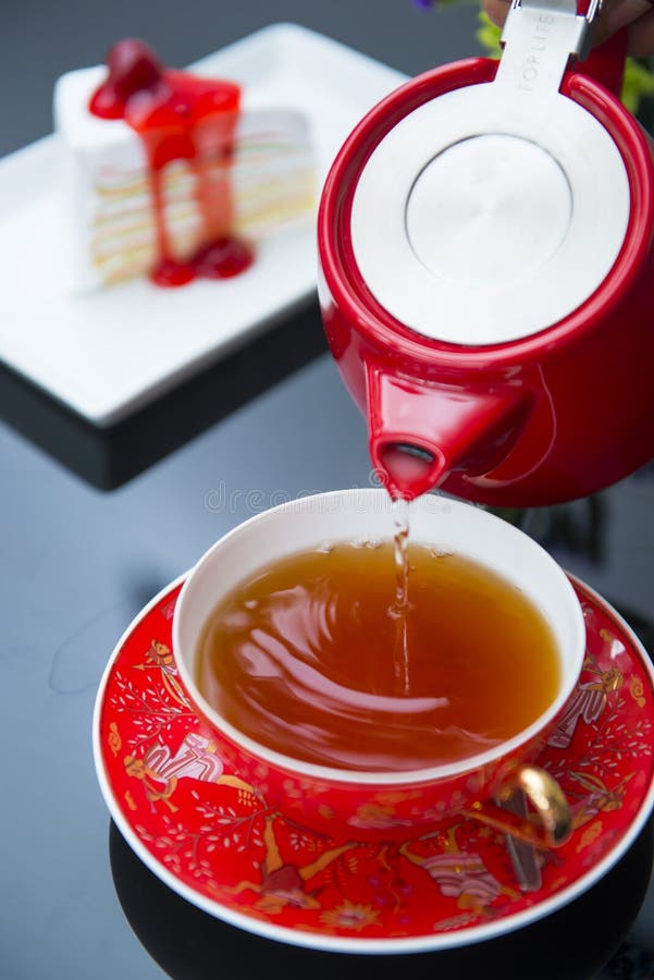 Pouring Hot Tea in the Red Cup Stock Image - Image of herbal, beverage ...