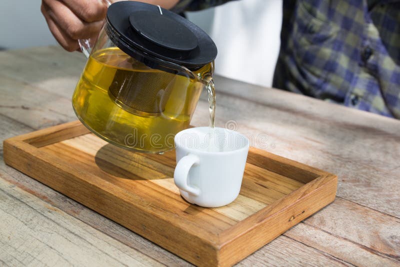 Pouring Hot Tea into the White Cup Stock Photo - Image of pouring ...