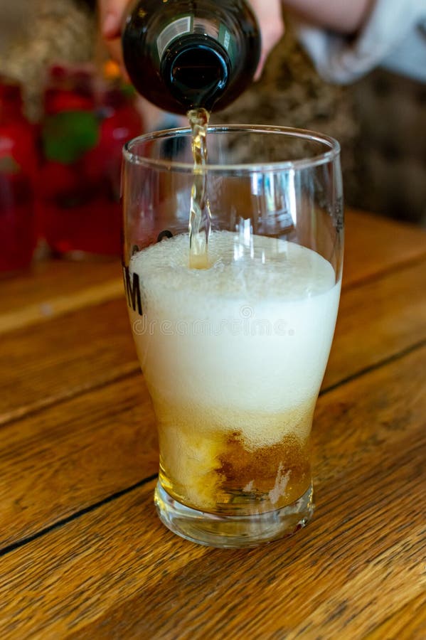 Pouring of Light Lager Beer in Glass Stock Image - Image of pouring ...