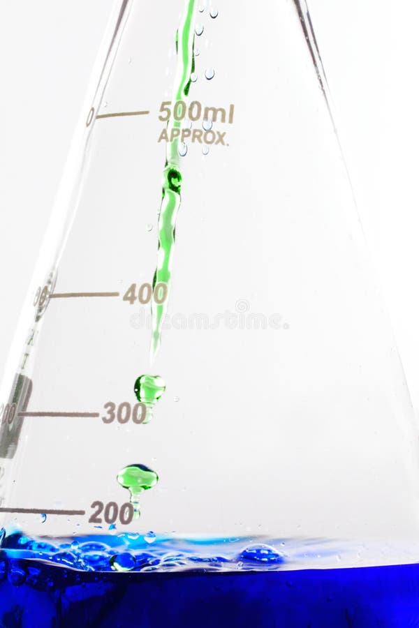 Pouring liquid into flask stock image. Image of science - 52405303
