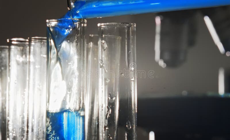 Pouring Liquid into Test Tubes Stock Photo - Image of discovery ...