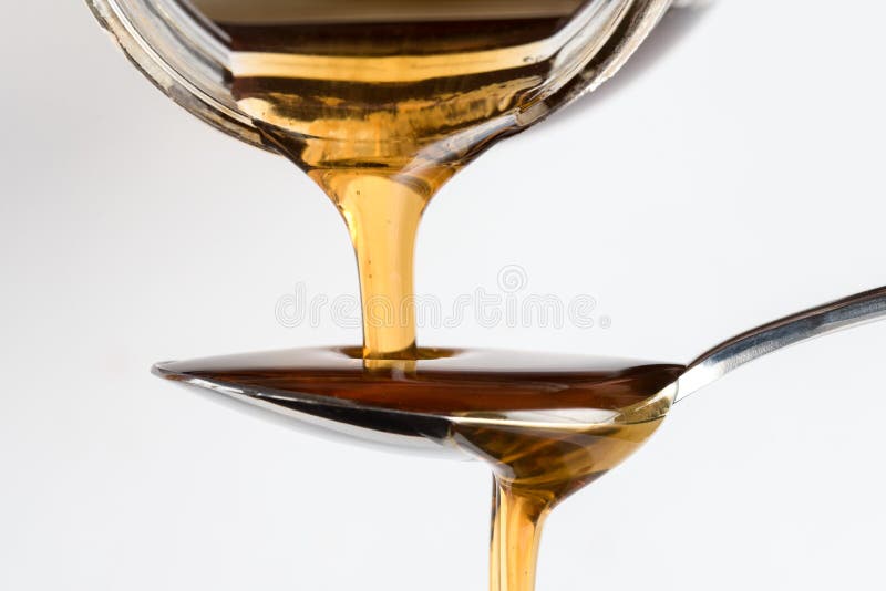 Pouring Maple Syrup on a Spoon Stock Photo - Image of food, pour: 184102252