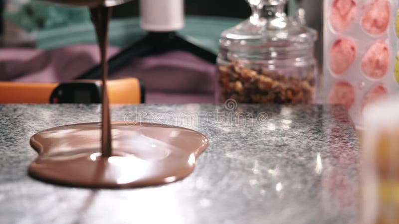 Pouring Melted Chocolate on the Marble Slab for Tempering Stock Footage ...