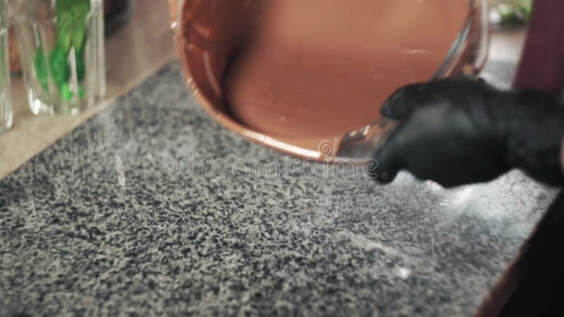 Pouring Melted Chocolate on the Marble Slab for Tempering Stock Footage ...