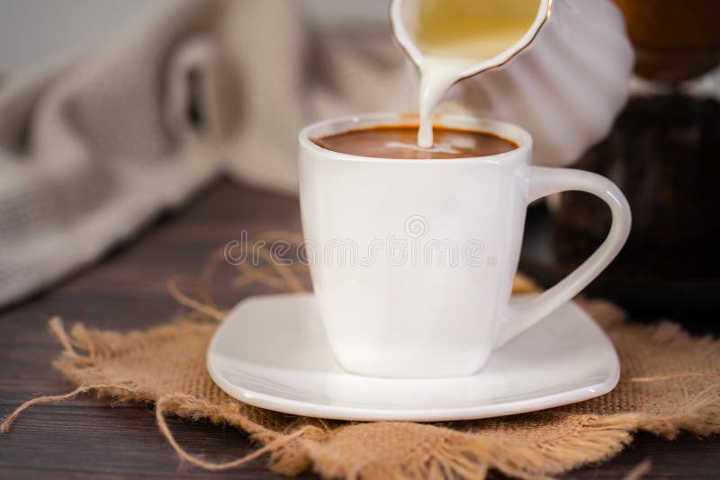 Pouring Milk into Coffee in a Cup Stock Image - Image of breakfast ...