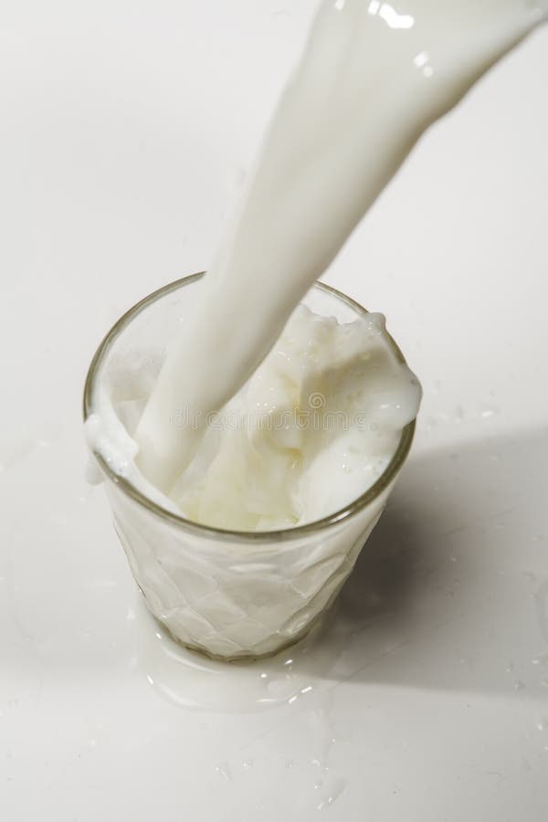 Pouring Milk or White Liquid Created Splash Stock Image - Image of ...