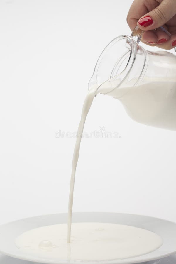Pouring of Milk from Jug into a ... Stock Image - Image of close ...