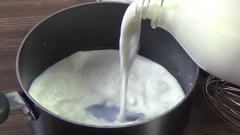 Pour The Milk Into A Saucepan. Stock Footage - Video of bowl, cute ...