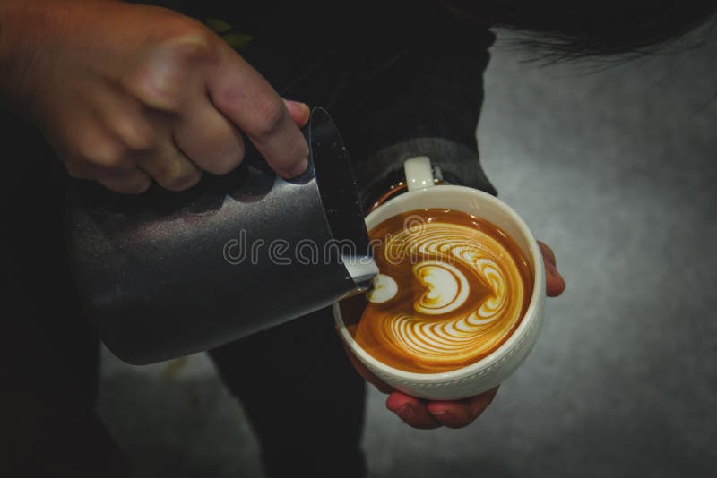 Pouring Milk from Pitcher To Cup of Coffee Stock Image - Image of ...