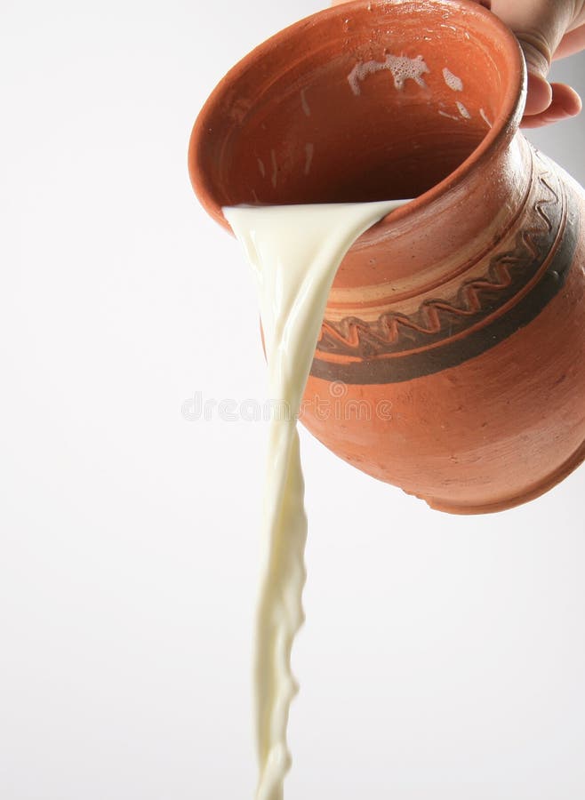 Pouring Milk from Rustic Clay Jar Stock Photo - Image of healthy, glass ...