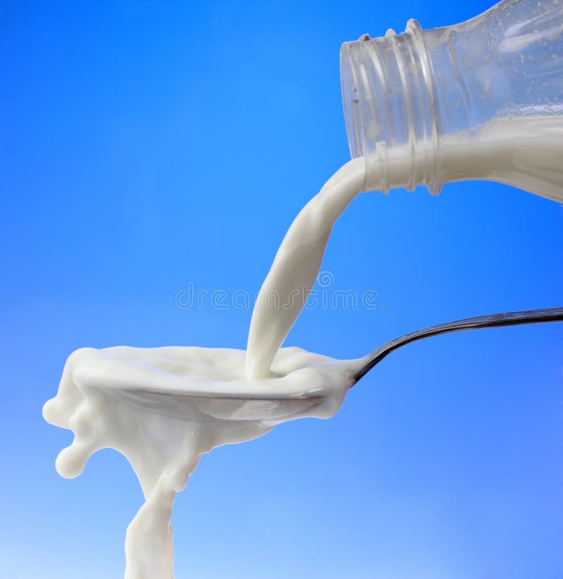 Pouring milk to the spoon stock image. Image of cold - 29056617