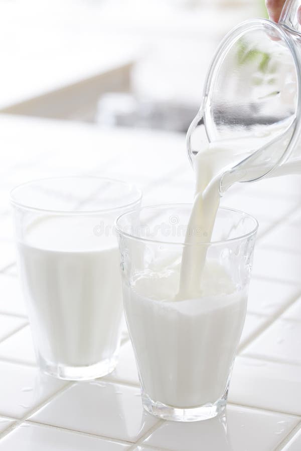 Pouring Milk in White Kitchen Stock Image - Image of white, products ...