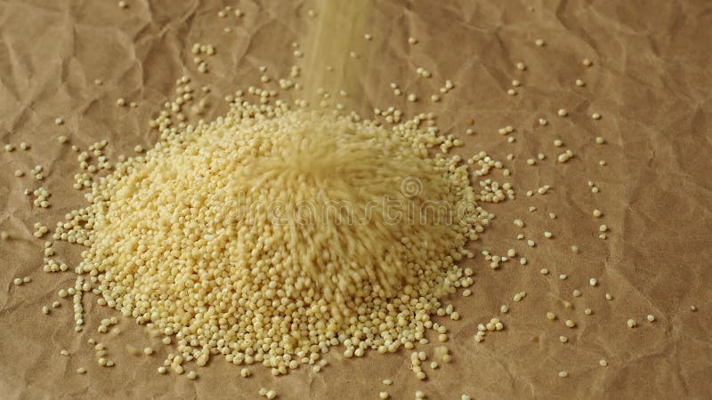 Pouring Millet on Crumpled Paper Stock Footage - Video of grain, vegan ...