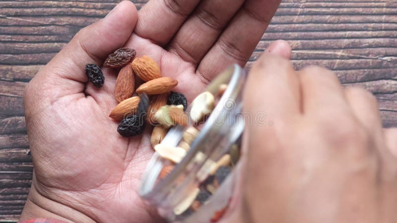 Pouring Mixed Nut on Hand Top View Stock Video - Video of cashew ...