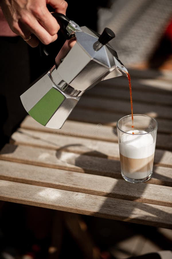 Pouring Morning Coffee from a Moka Pot Stock Photo - Image of wood ...