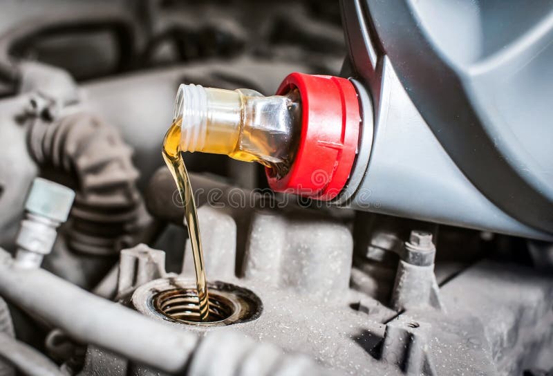 Pouring New Engine Oil into the Car Engine. Close-up Stock Photo ...