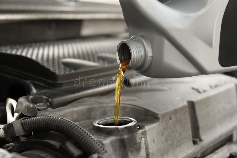 Pouring Oil into Car Engine Stock Photo - Image of pour, engine: 121006038