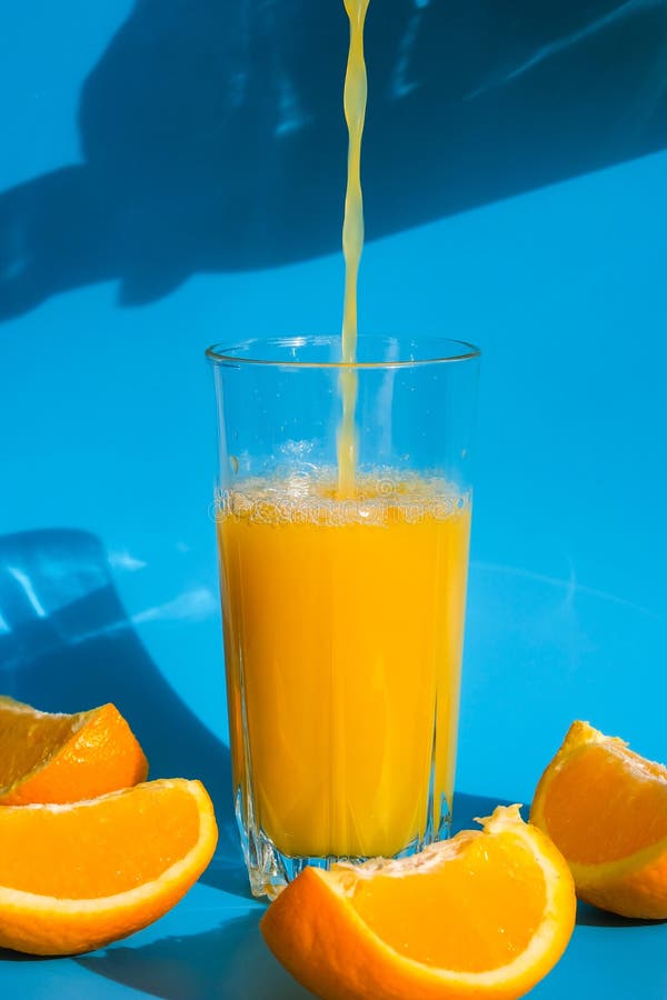 Pouring Orange Juice Stream from Jug into Glass of Squeezing Orange ... Pouring Orange Juice Stream from Jug into Glass of Squeezing Orange ...