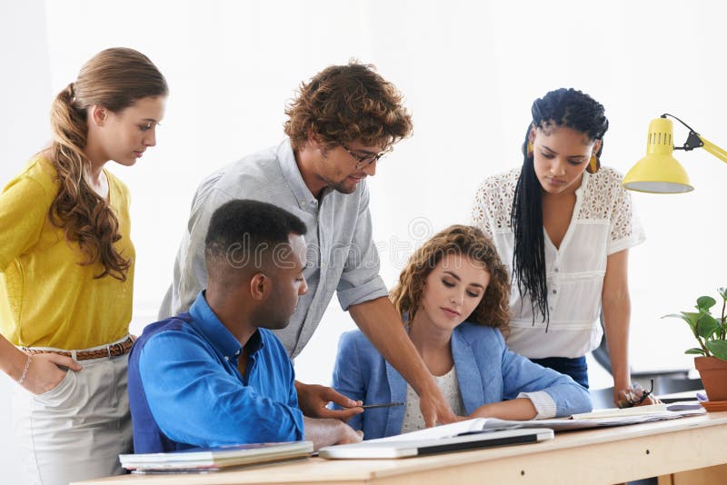 Pouring Over the Project. a Group of Young Designers Going Over ...